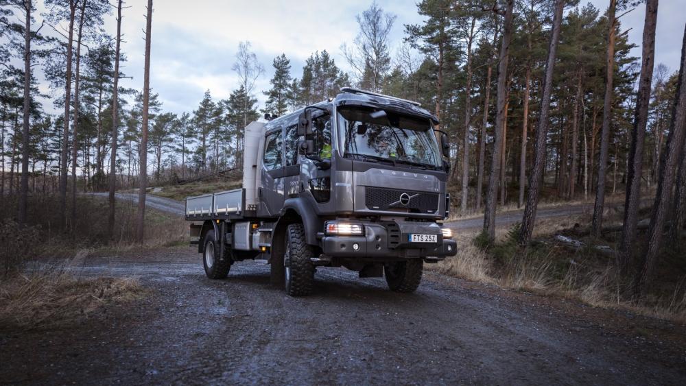 Volvo Truck in Serene Forest Setting - backiee