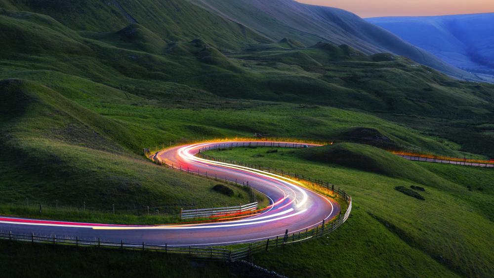Twilight Switchbacks and Light Trails Across Emerald Peak District Hills - backiee