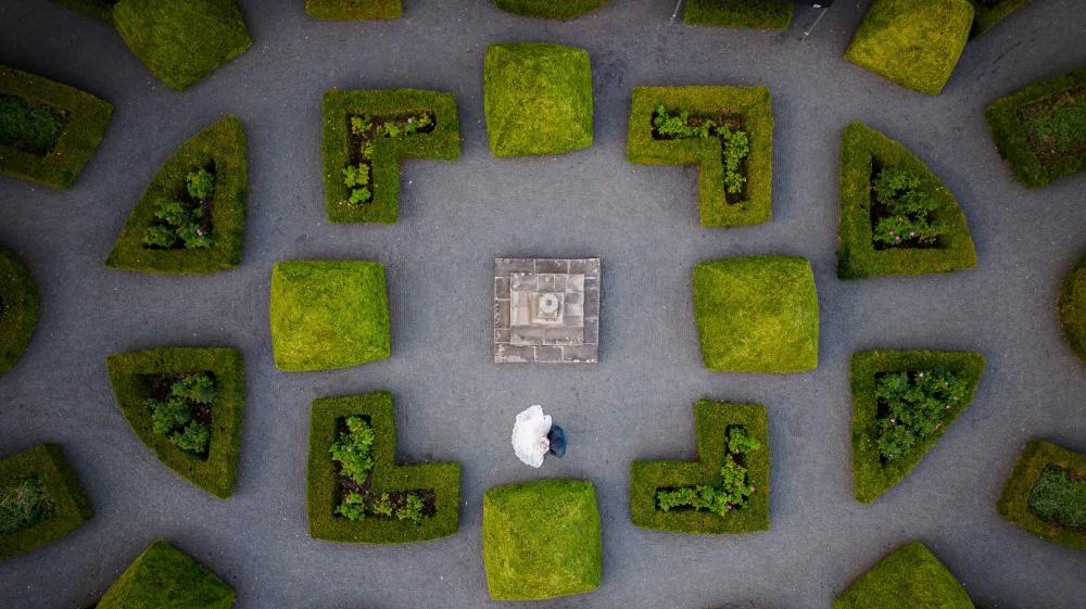 Aerial Symmetry Wedding Moment in Plas Newydd Gardens Llangollen - backiee