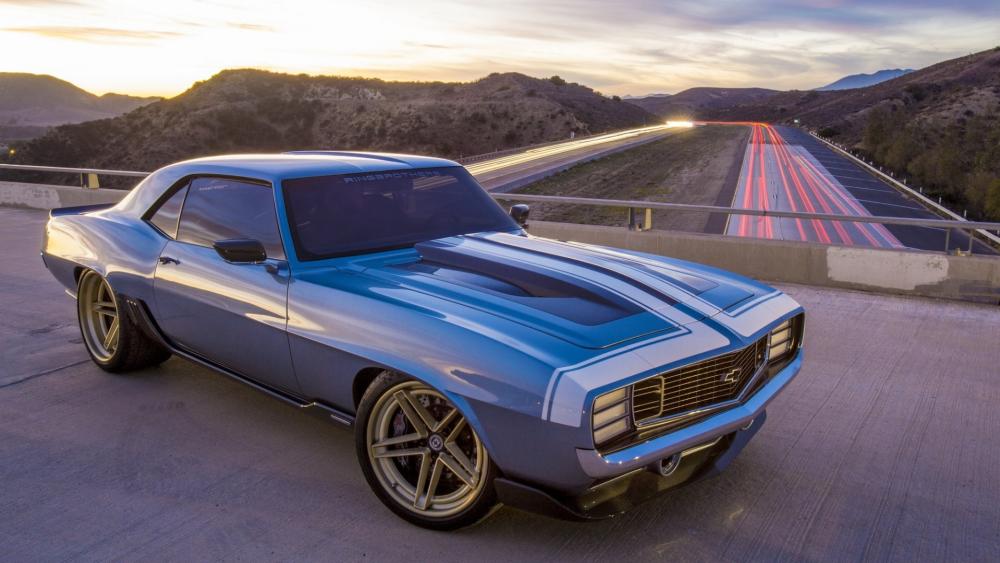 Blue 1969 Chevrolet Camaro Muscle Car at Sunset Highway Overlook - backiee