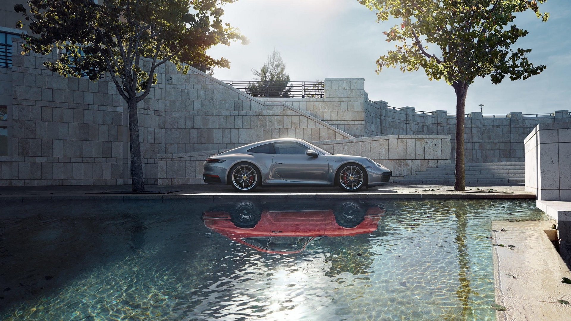 Porsche 911 Elegance by a Reflective Pool - backiee