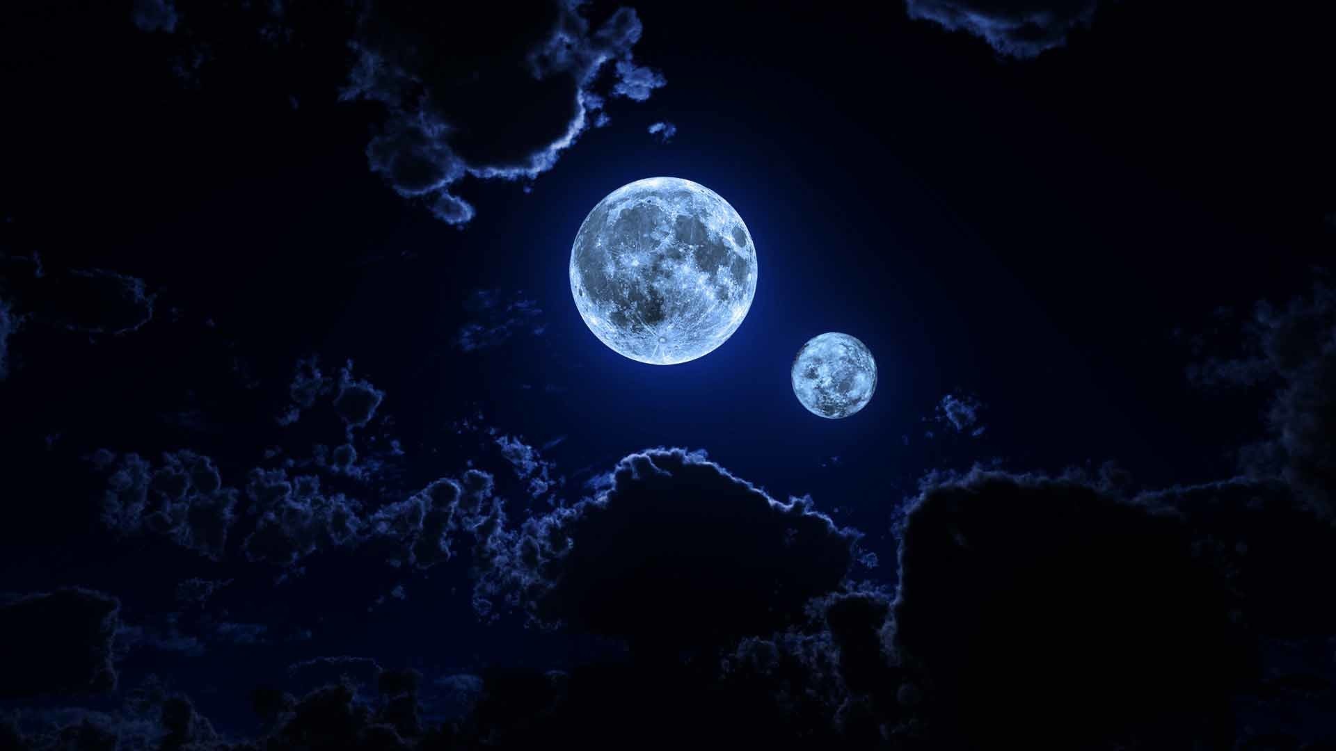 Twin Moons Illuminating the Midnight Sky - backiee