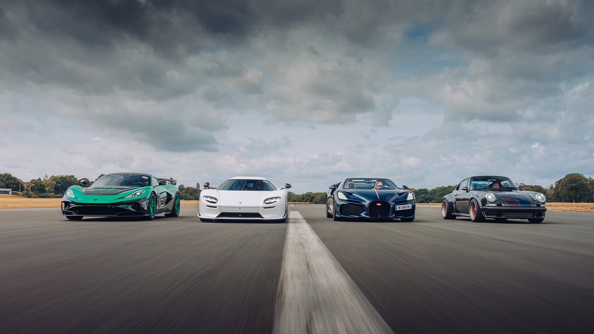 Sleek Lineup of Supercars in Action - backiee