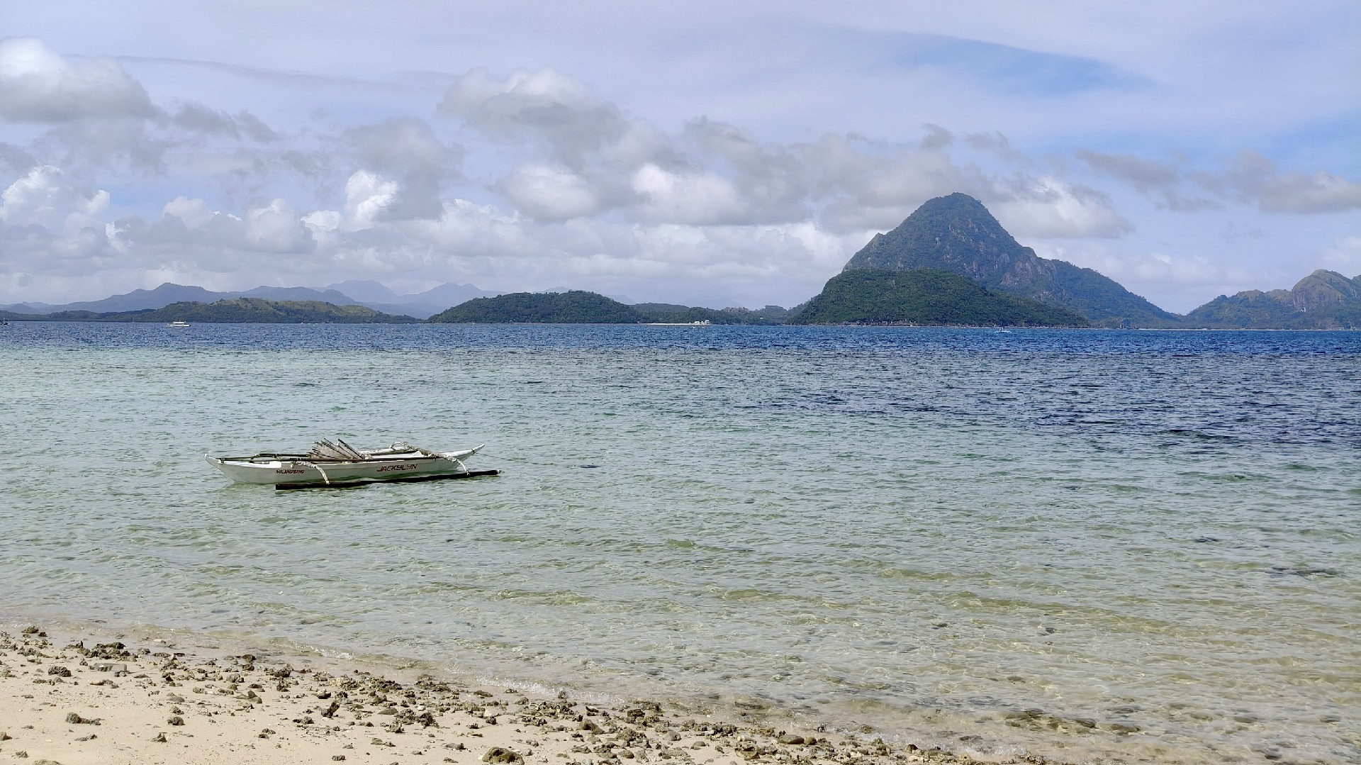 A Boat by the Sea - backiee