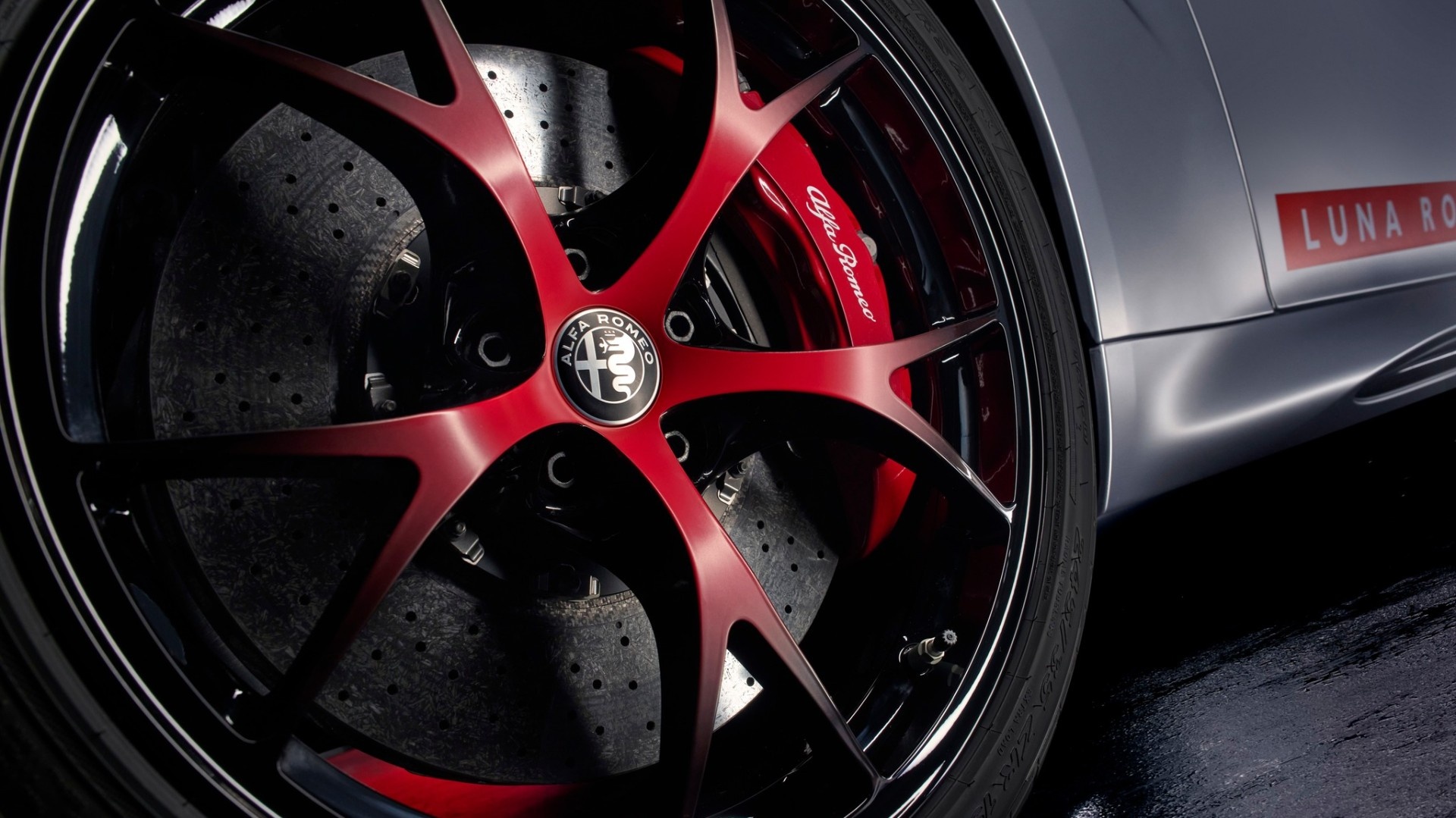 Crimson Alfa Romeo Alloy Wheel Close Up Performance Detail - backiee