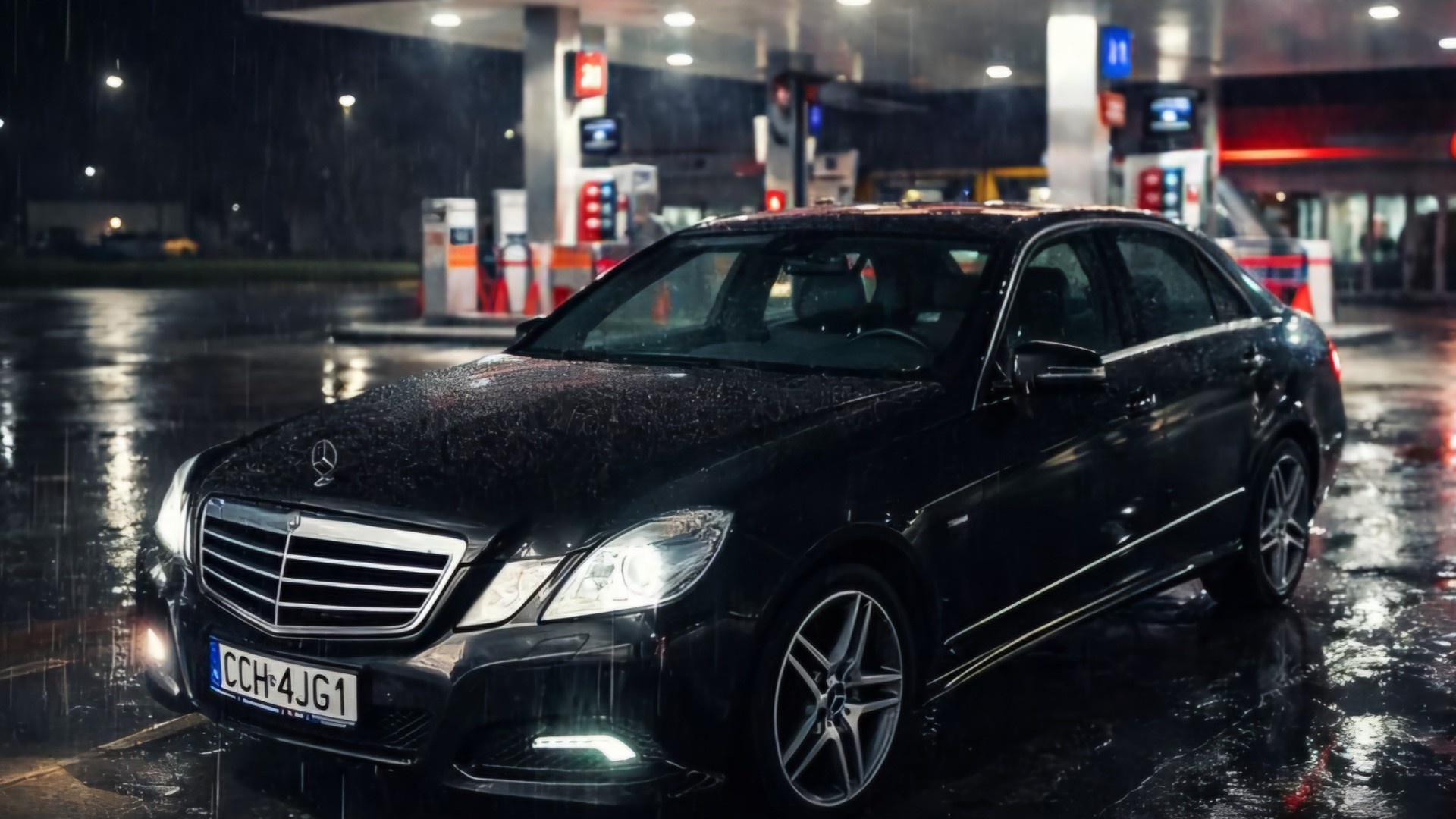 Midnight Mercedes Benz Sedan in Rainy Gas Station Glow - backiee
