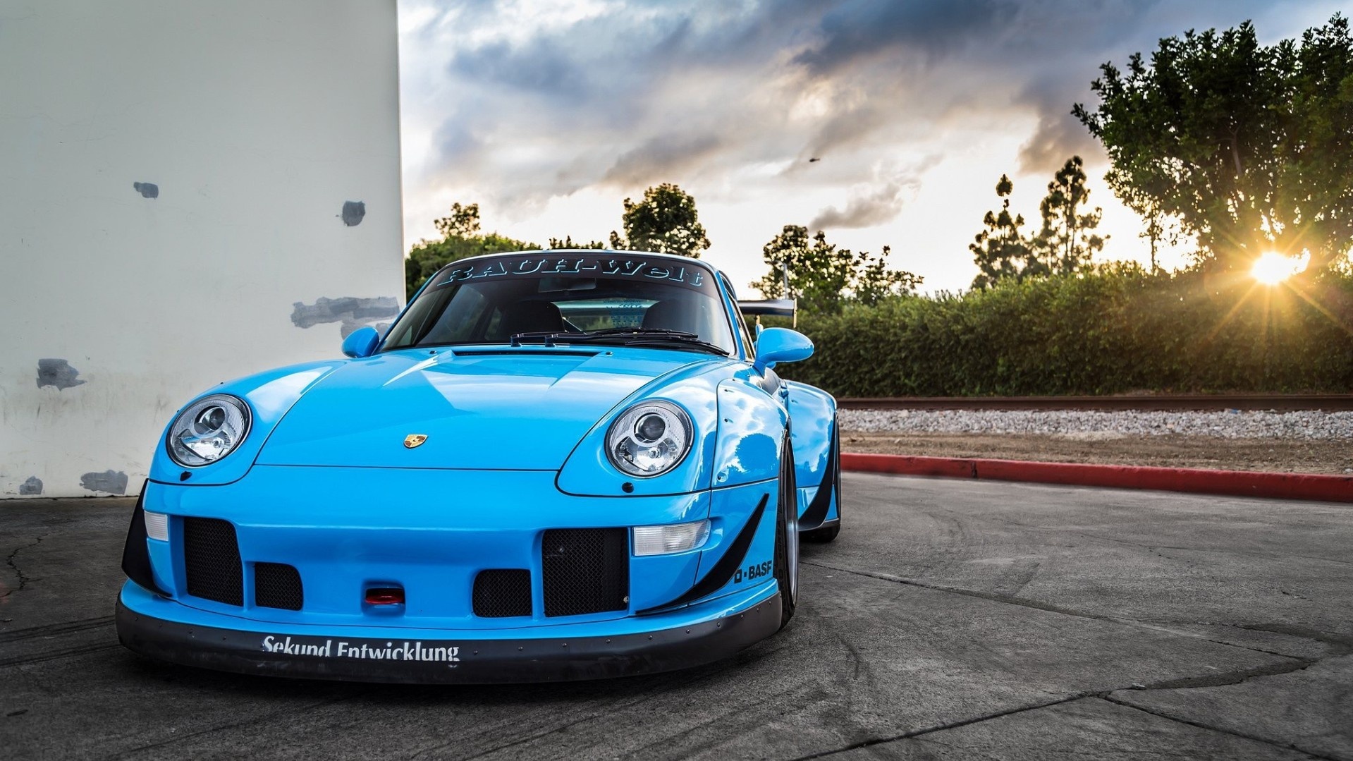 Electric Blue Porsche 911 Stance at Sunset Street Corner - backiee