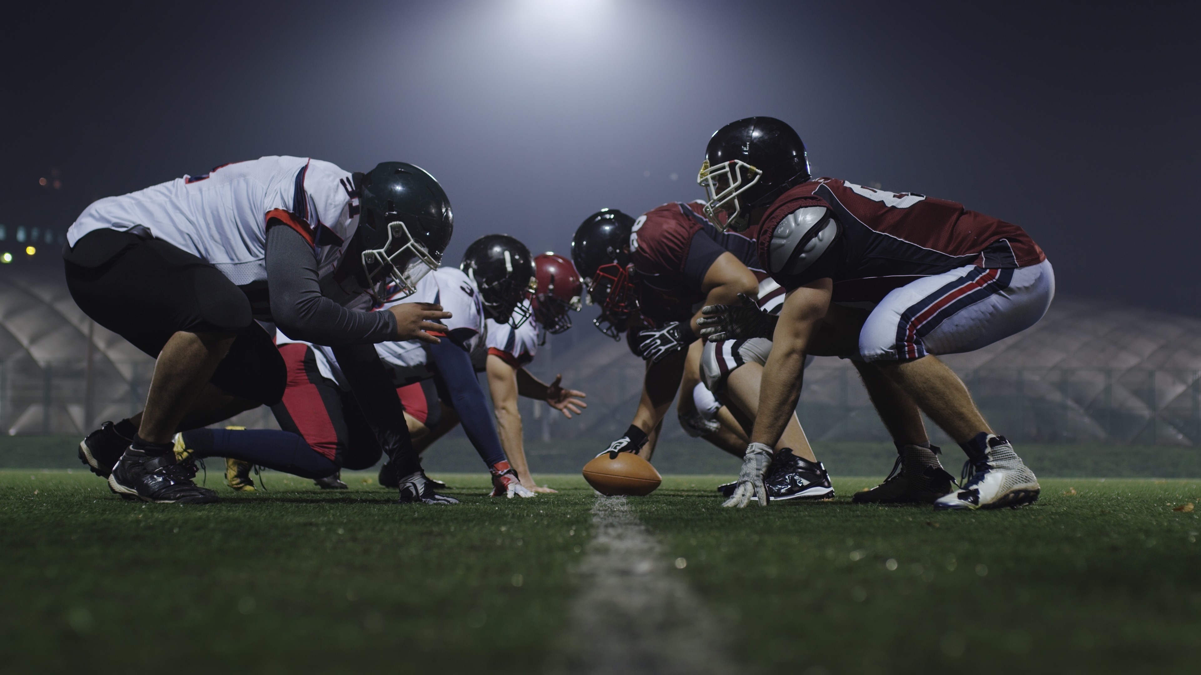 Football Showdown Under the Lights - backiee