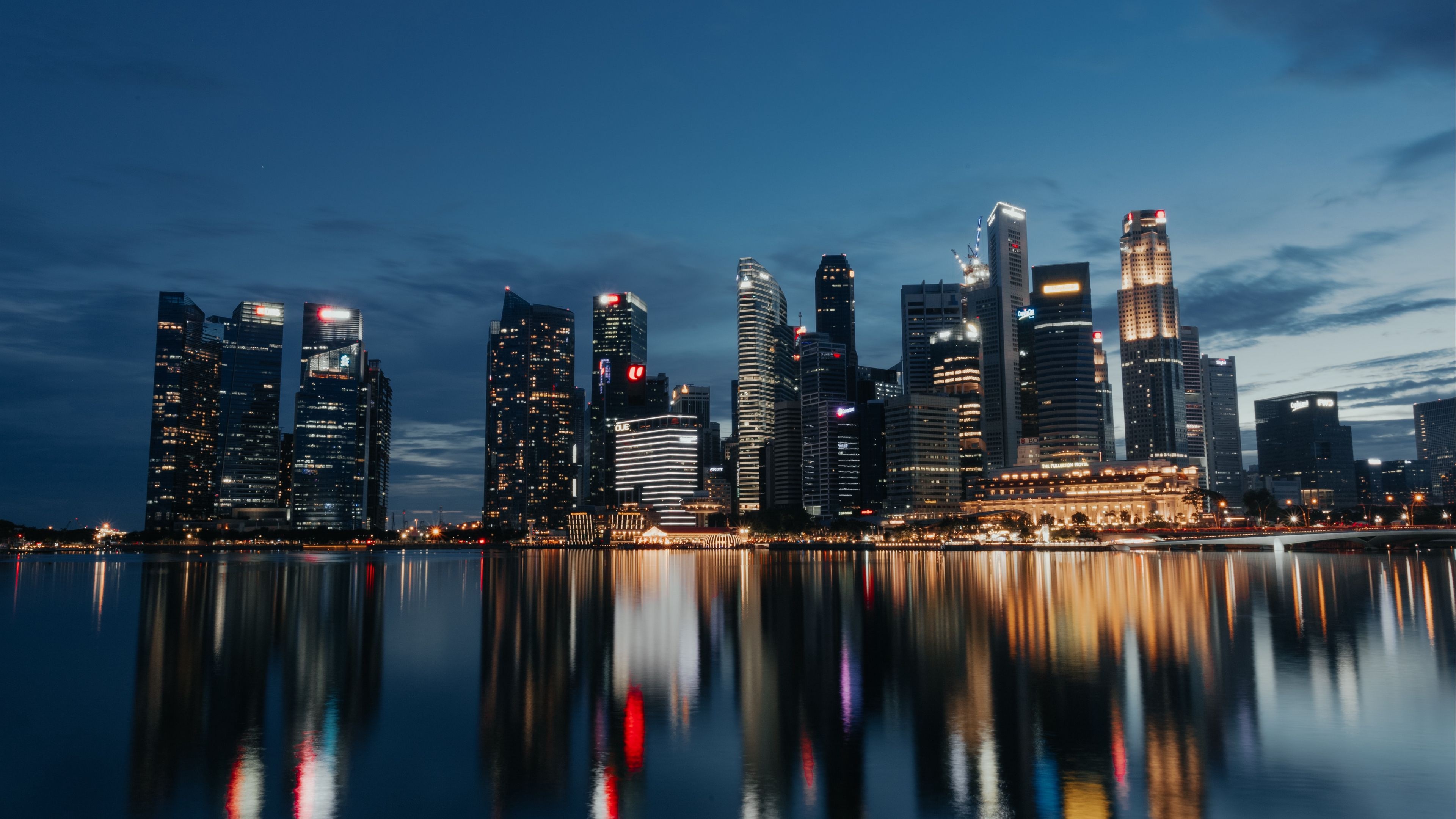 Singapore Skyline at Dusk Glowing Cityscape - backiee