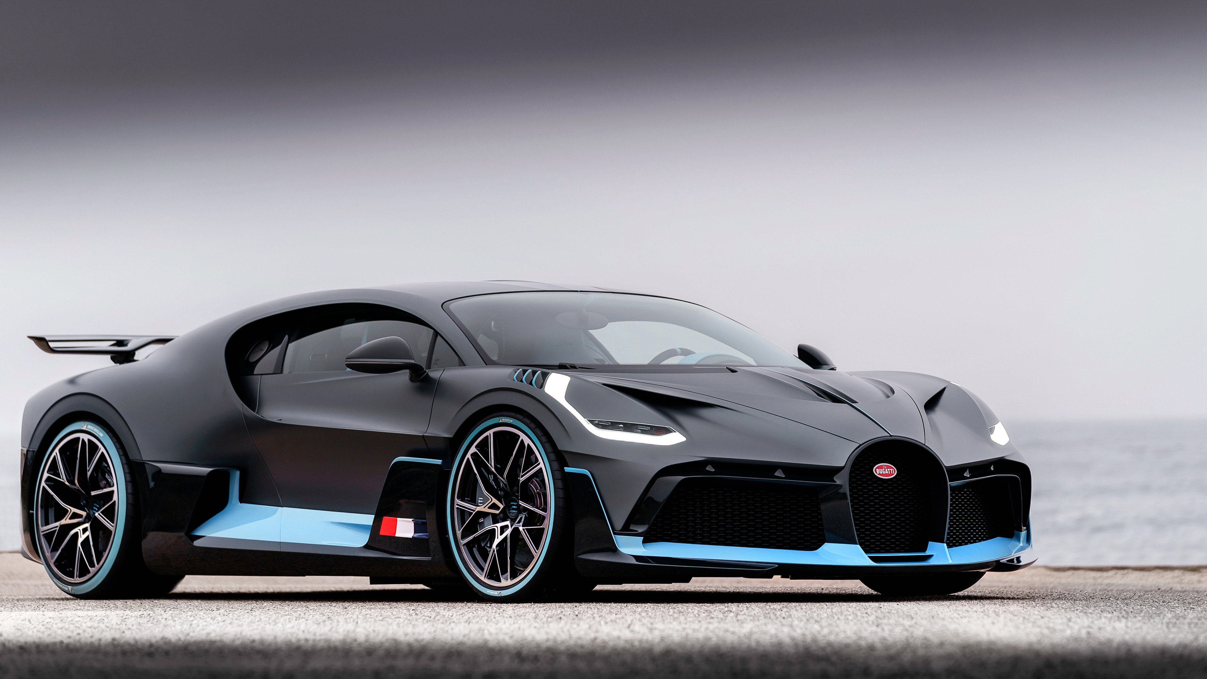Bugatti Divo Supercar in 4K Matte Black and Blue Elegance - backiee