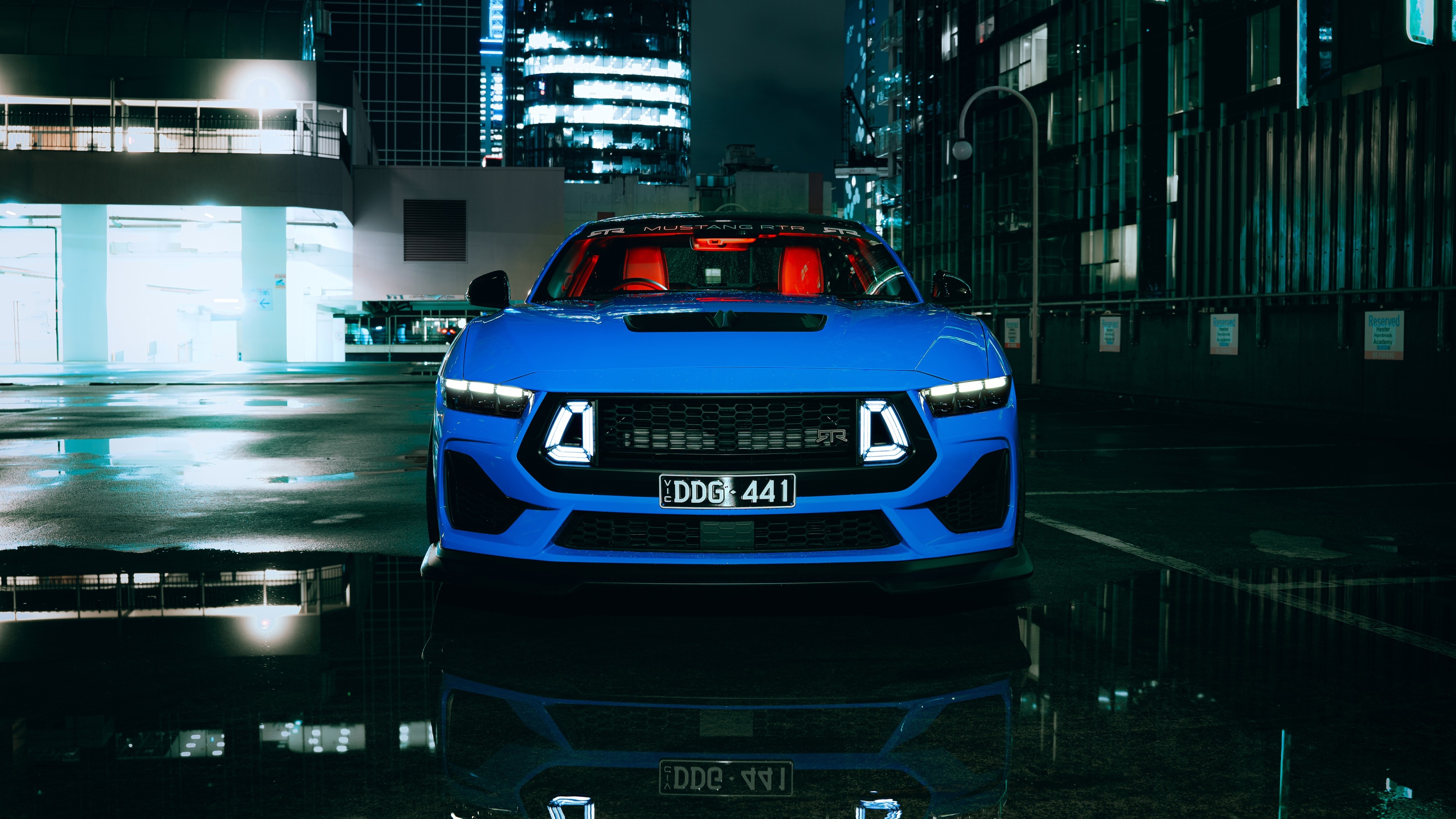 Neon Night Ford Mustang Muscle Car in Rainy City Streets - backiee