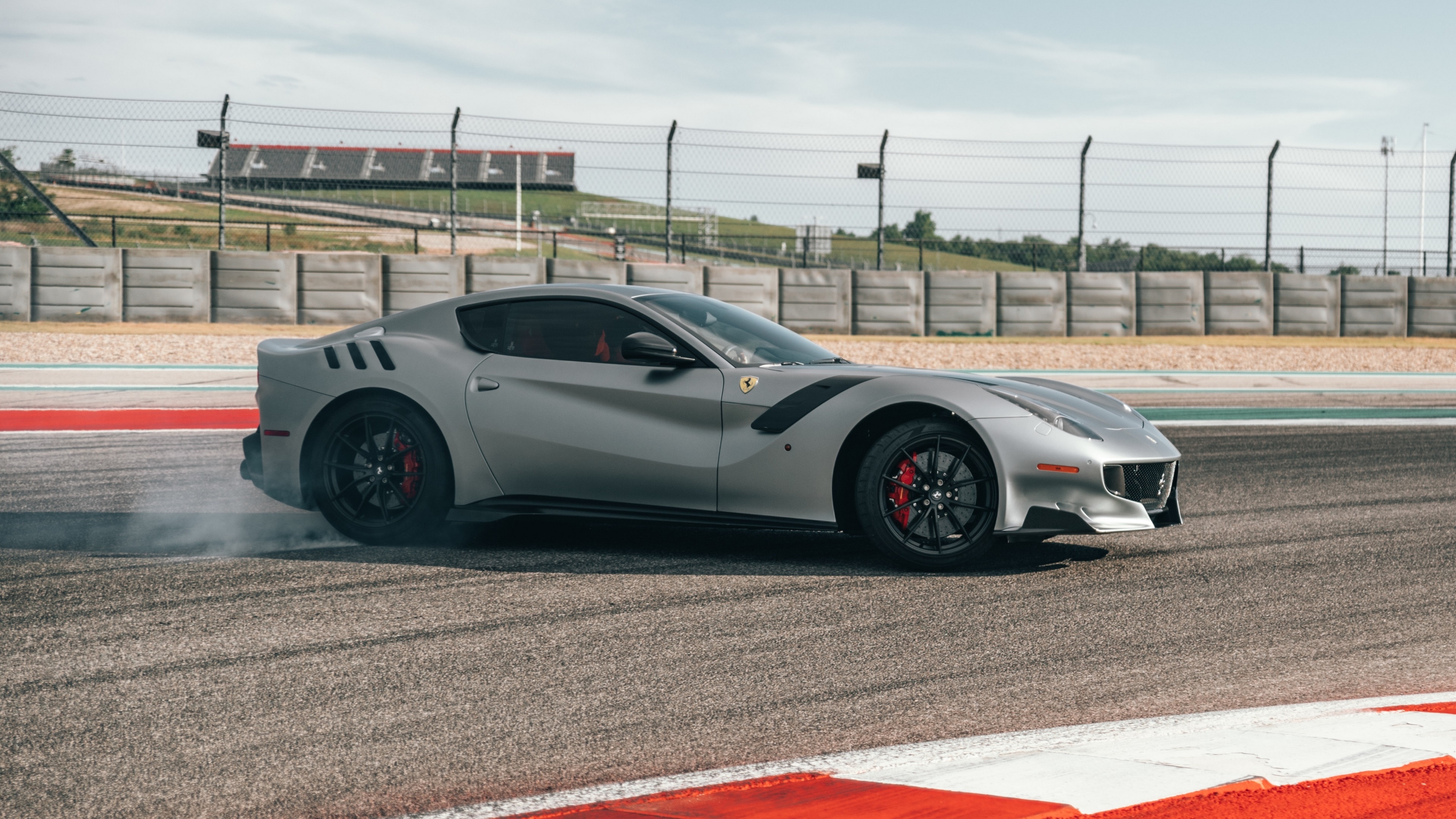 Ferrari F12tdf Trackside Drift in Sleek Silver 4K Wallpaper - backiee