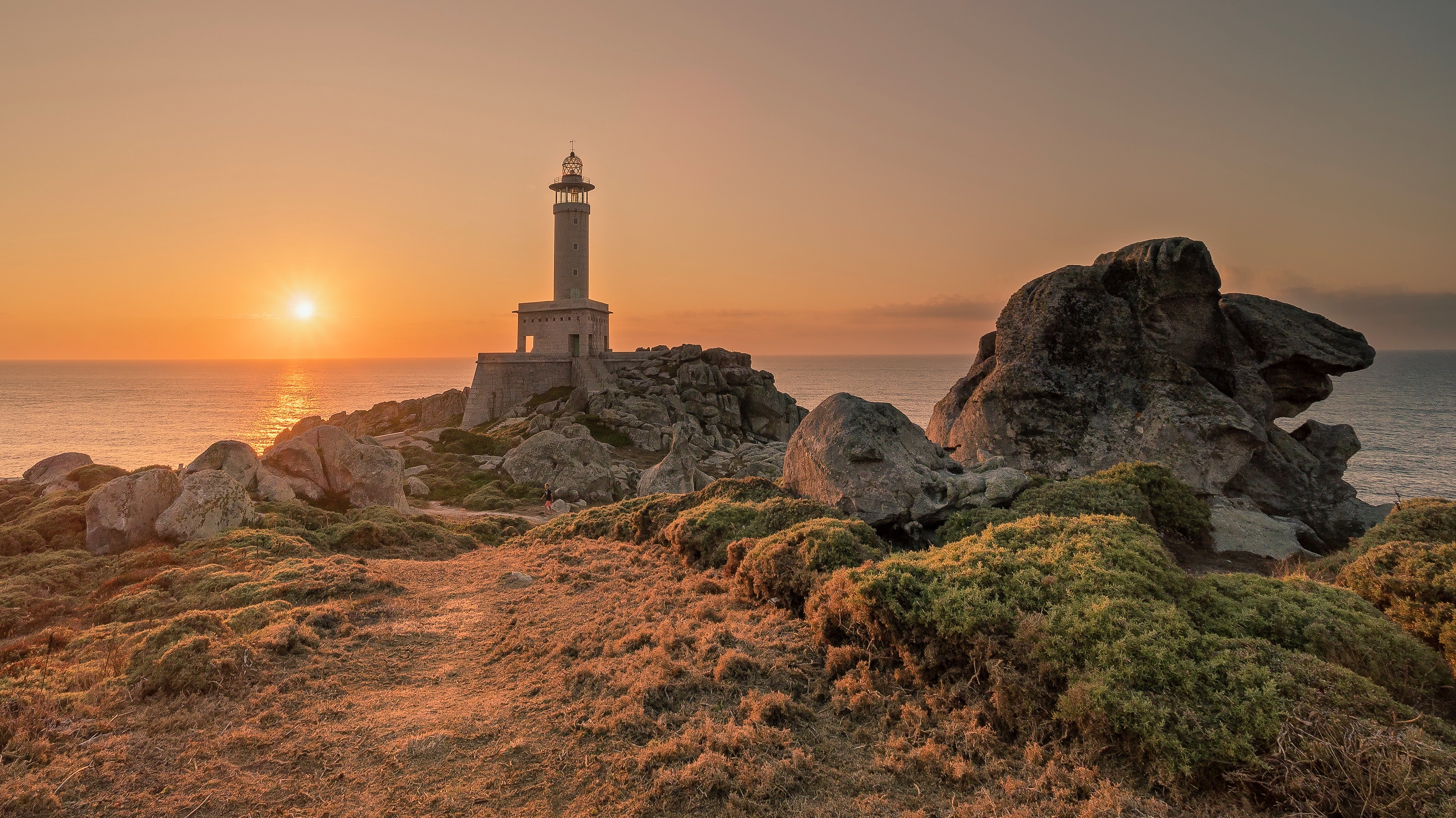 Sunset Sentinel at Punta Nariga Lighthouse on the Galician Coast - backiee