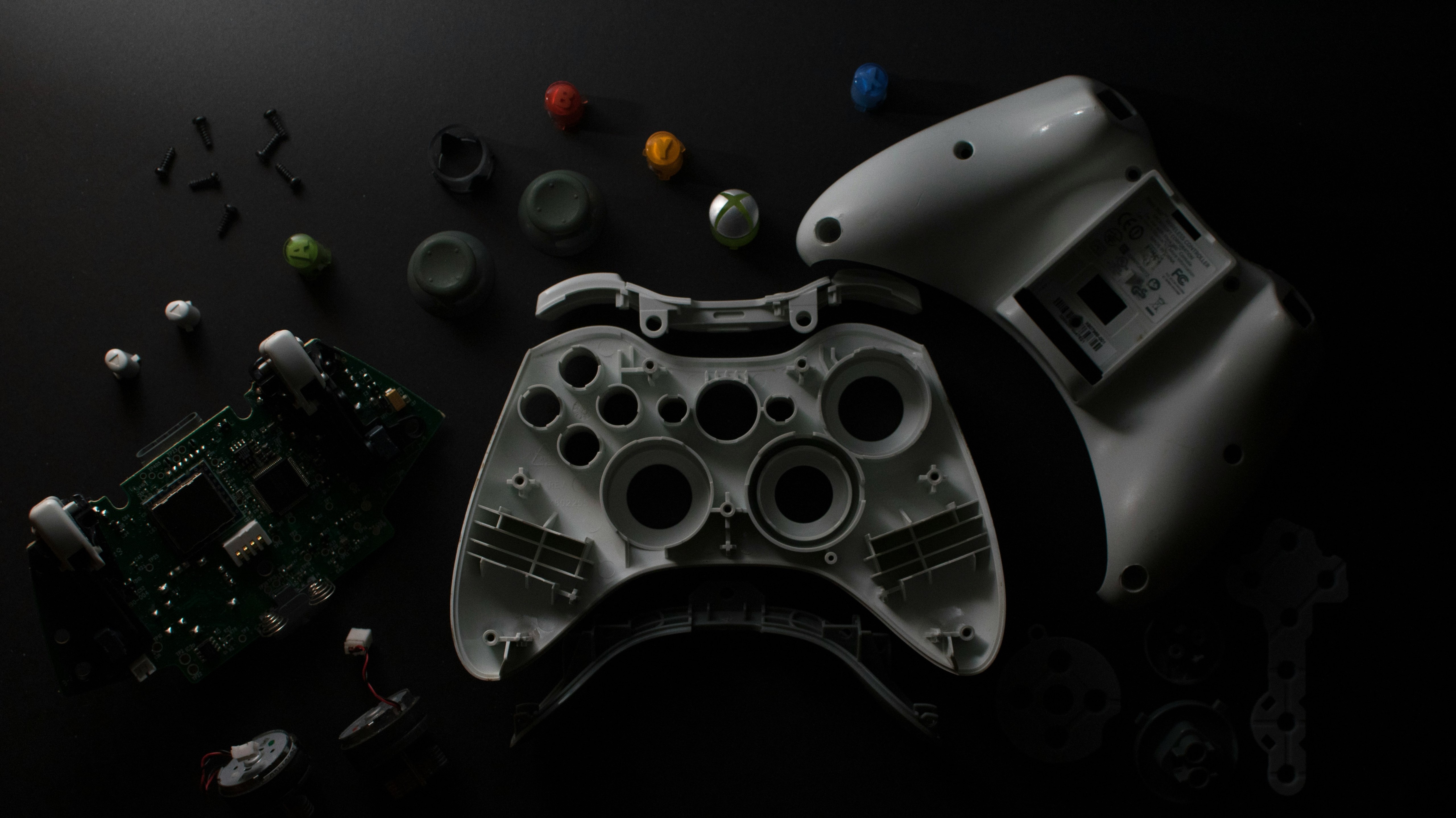 Xbox Controller Disassembled on Black Background - backiee