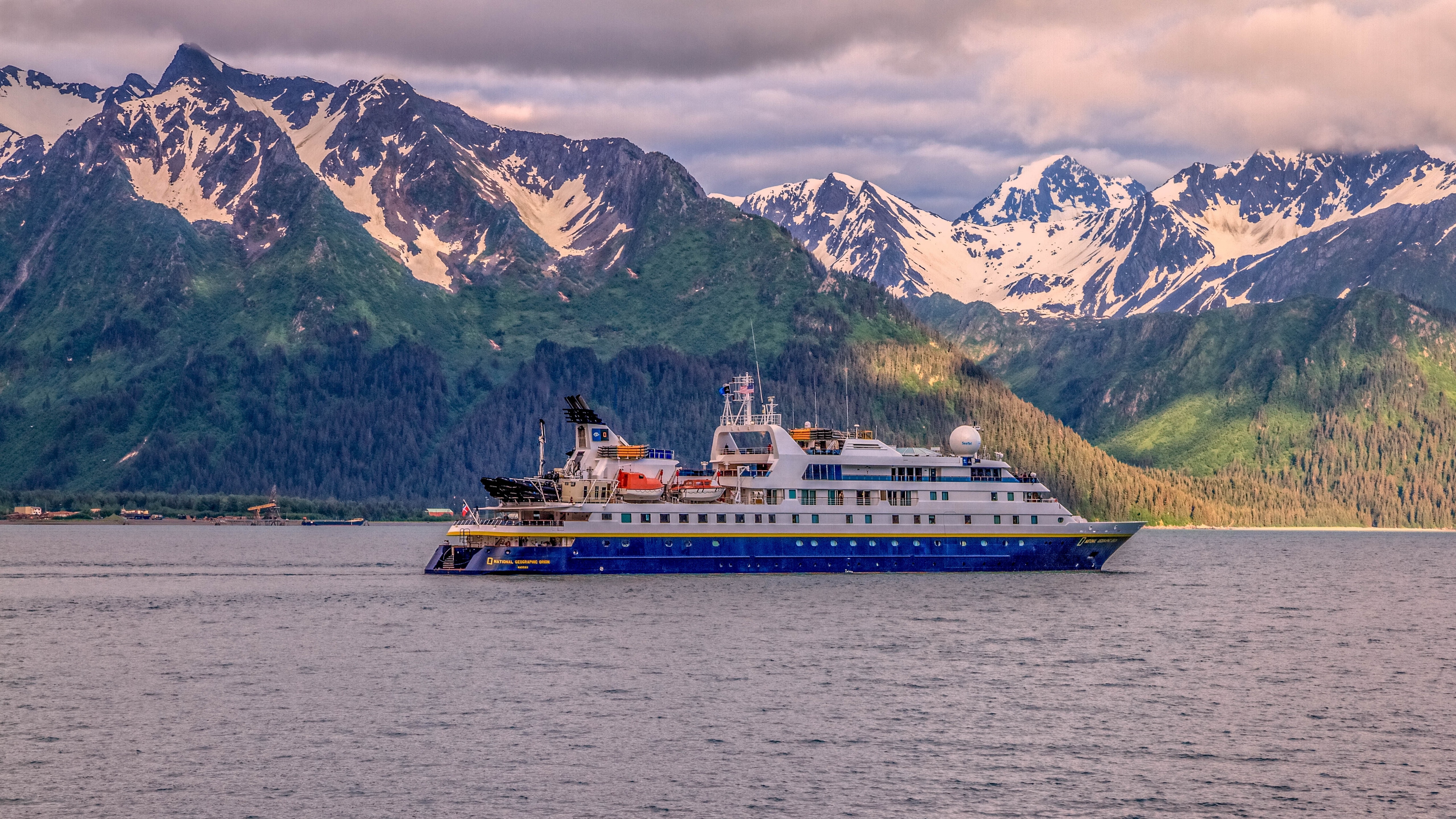 National Geographic Orion Expedition Ship Beneath Snowcapped Coastal ...
