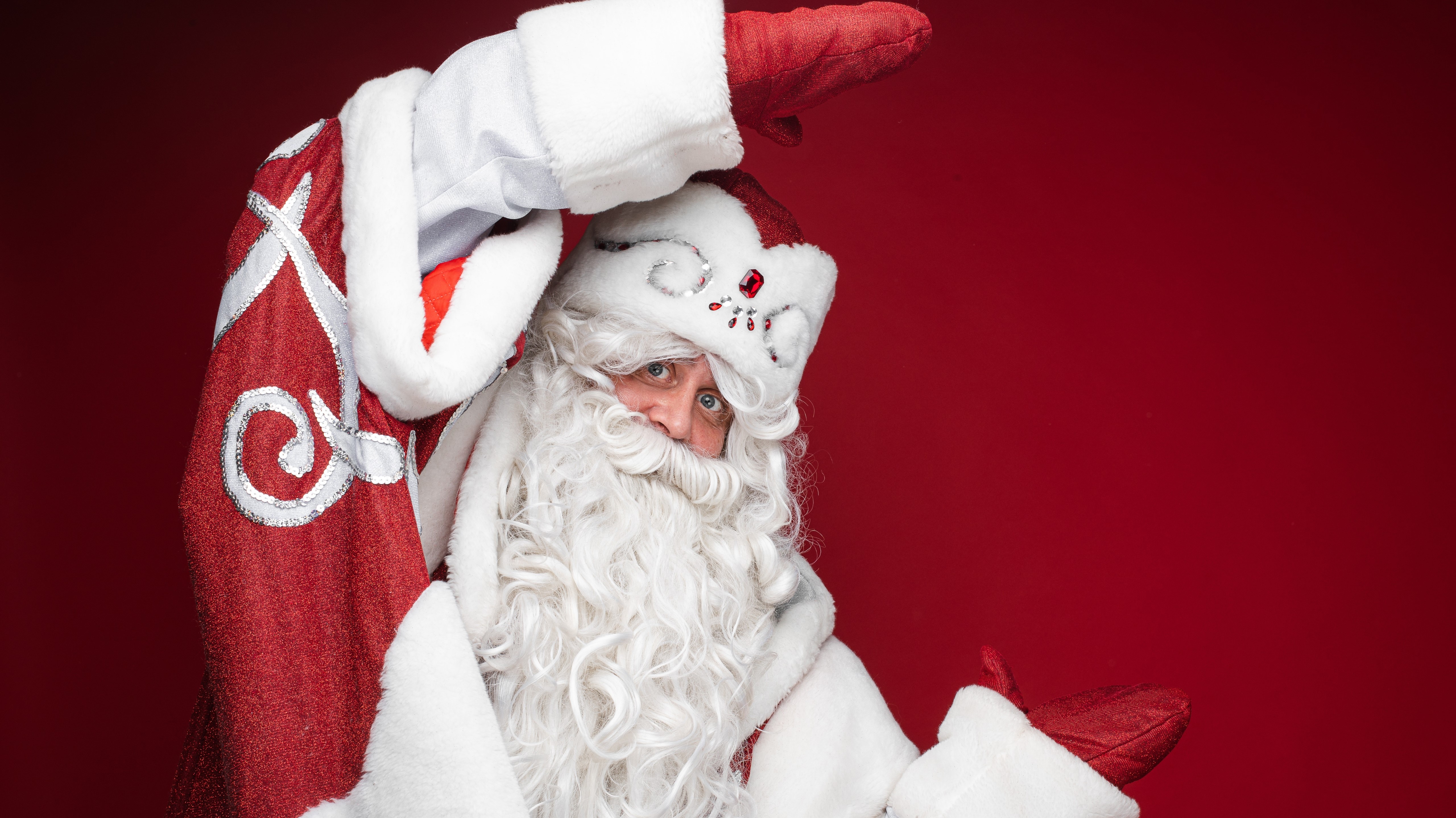 Santa Claus Close Up Against Deep Red Holiday Background - backiee