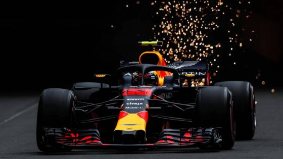 F1 Car Speeds Through Sparks at Night - backiee