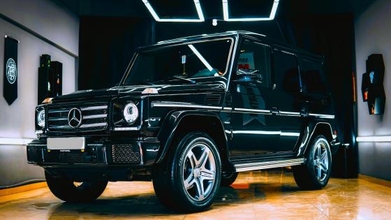 Sleek Black Luxury SUV Dominates the Showroom - backiee