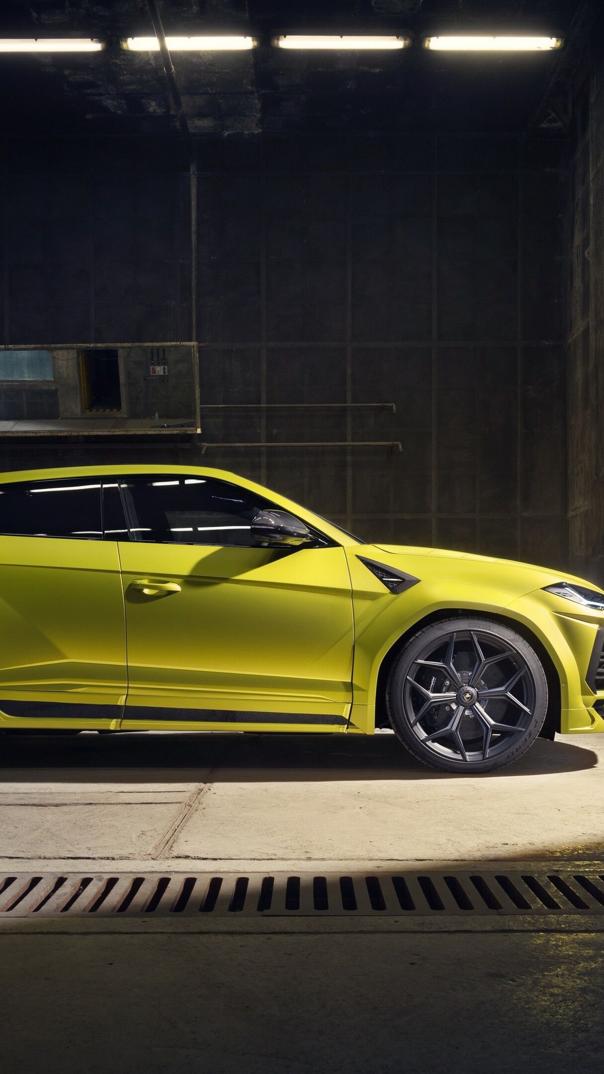 Lamborghini Urus in Neon Yellow Waiting at the Hangar Door - backiee