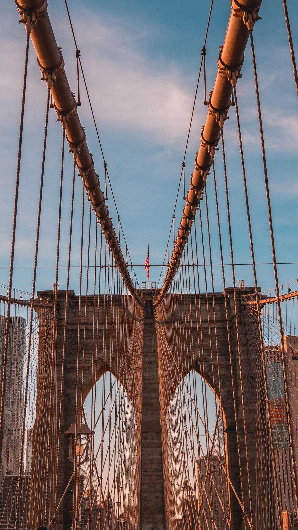 Sunlit Brooklyn Bridge Cables Framing Manhattan Skyline in New York ...