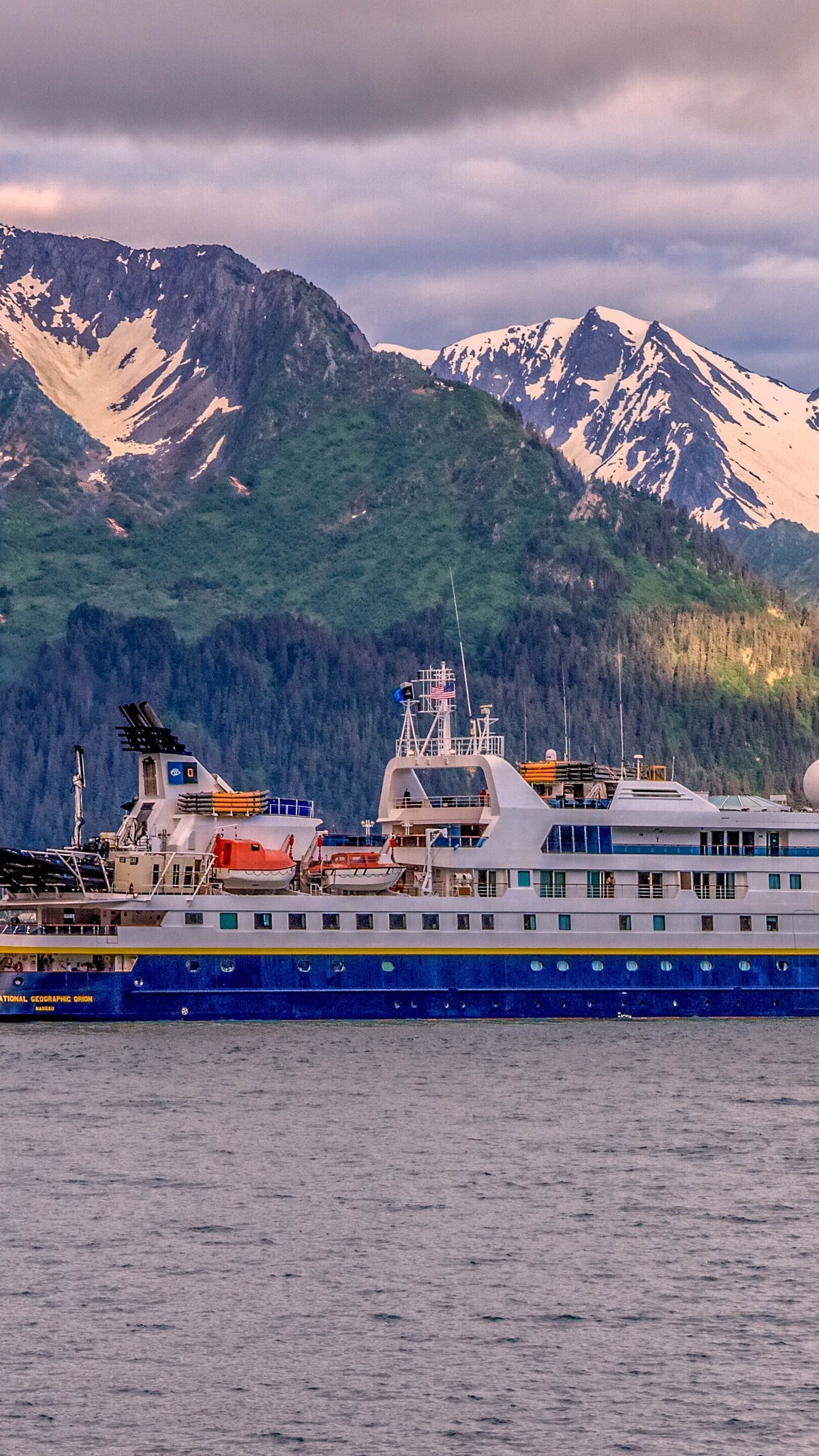 National Geographic Orion Expedition Ship Beneath Snowcapped Coastal ...