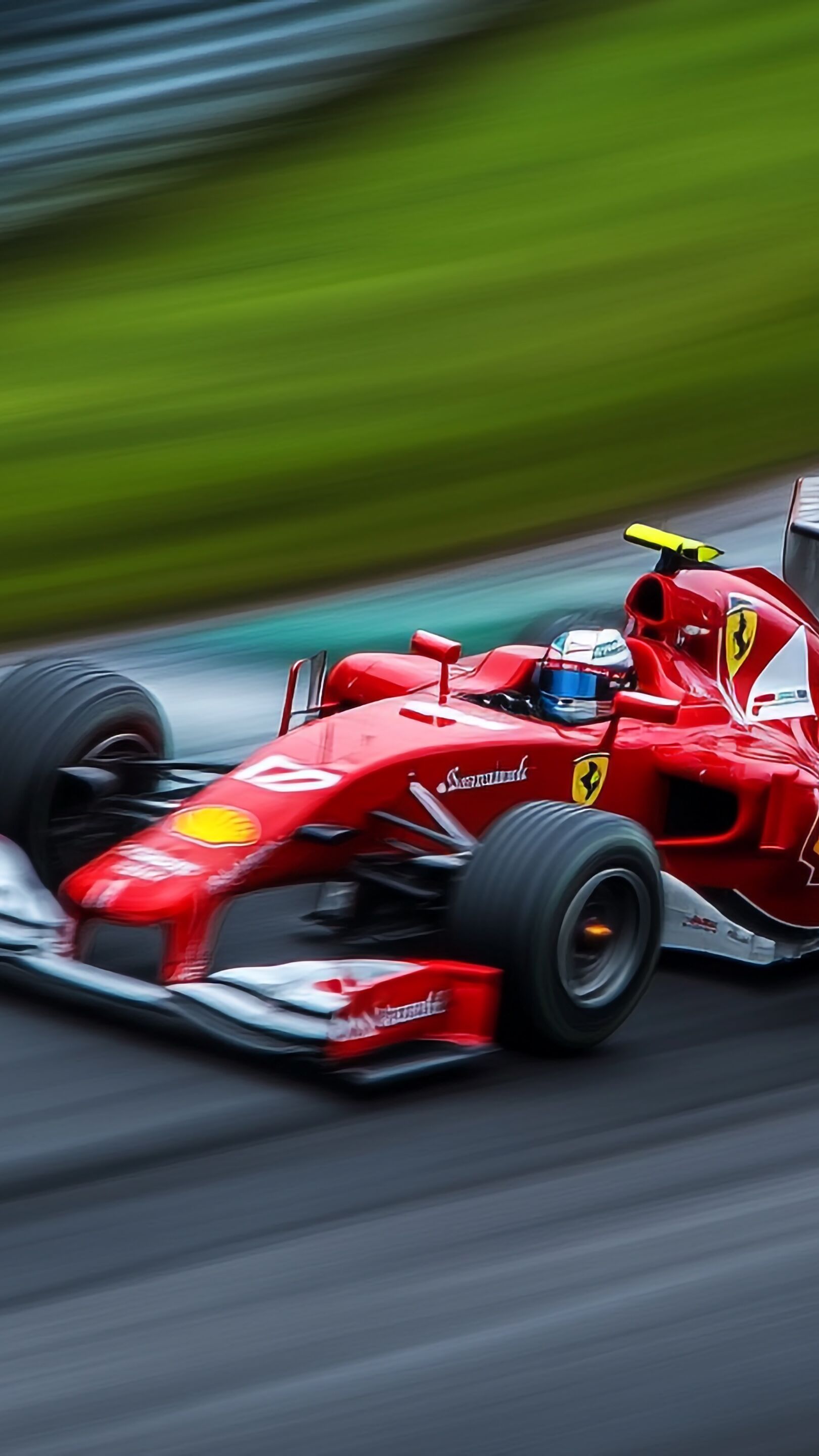 Formula 1 Red Race Car Blazing Through a High Speed Corner - backiee