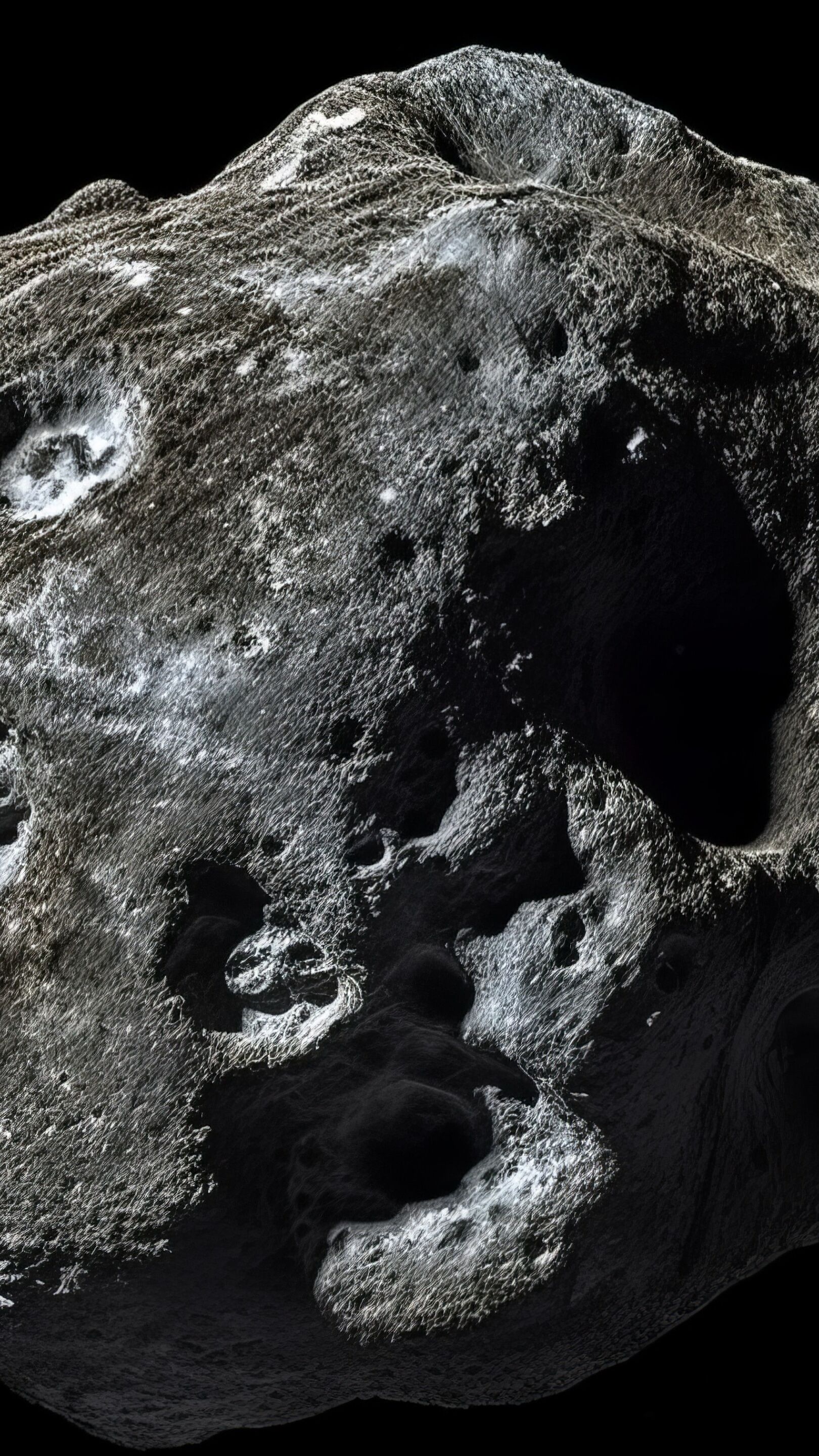 Lone Cratered Asteroid Drifting Through Silent Black Space - backiee