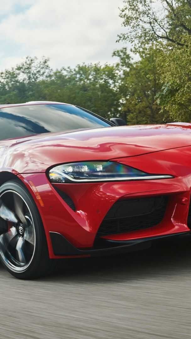 Red Toyota Supra in Motion on Scenic Road - backiee