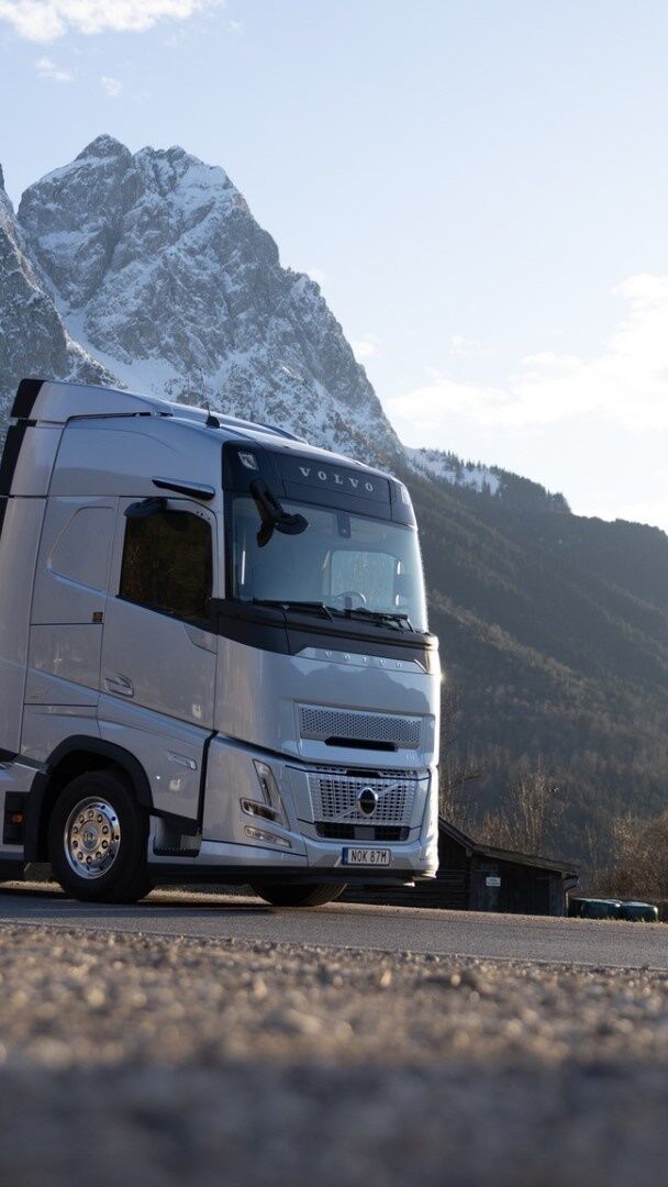 Volvo Truck in Majestic Mountain Landscape - backiee