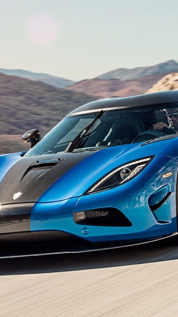 Sleek Hypercar on Scenic Mountain Drive - backiee