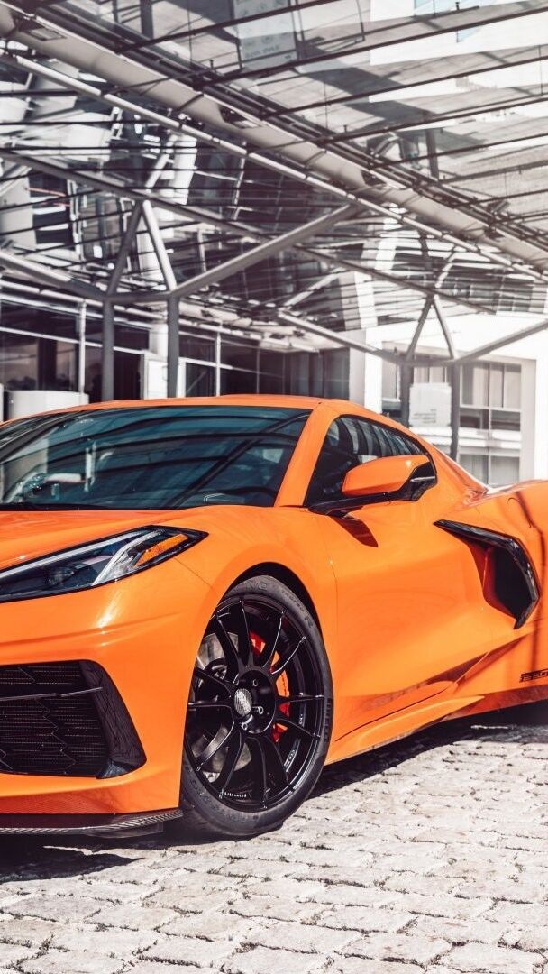 Vibrant Ride An Orange Corvette Dream - backiee