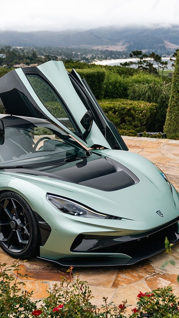 Sleek Luxury Rimac Nevera Supercar in Stunning Outdoor Setting - backiee