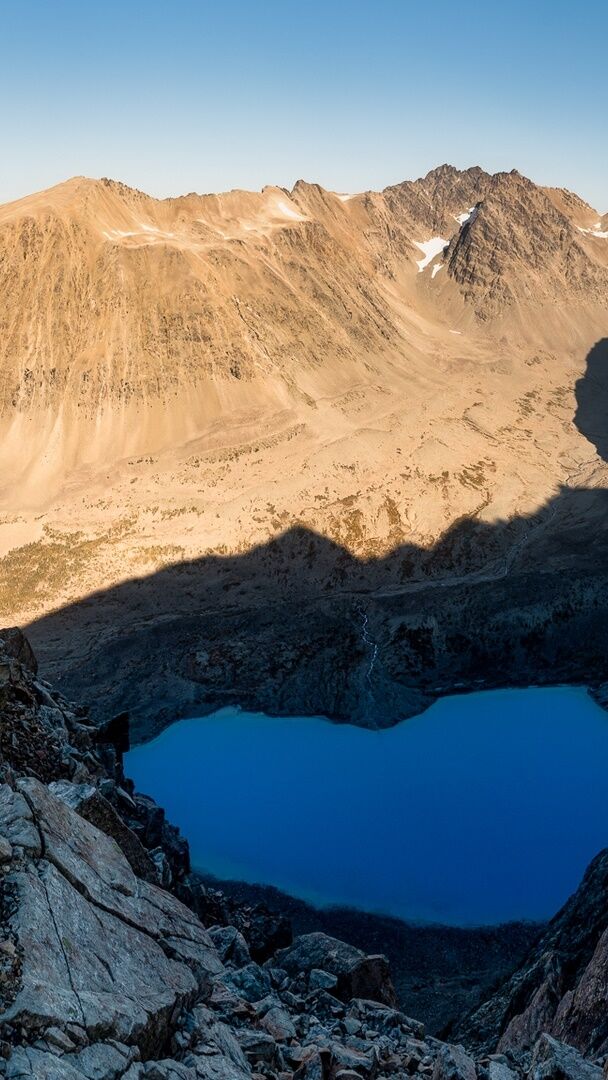 Evening Mountain Vista Above a Turquoise Heart Shaped Lake - backiee
