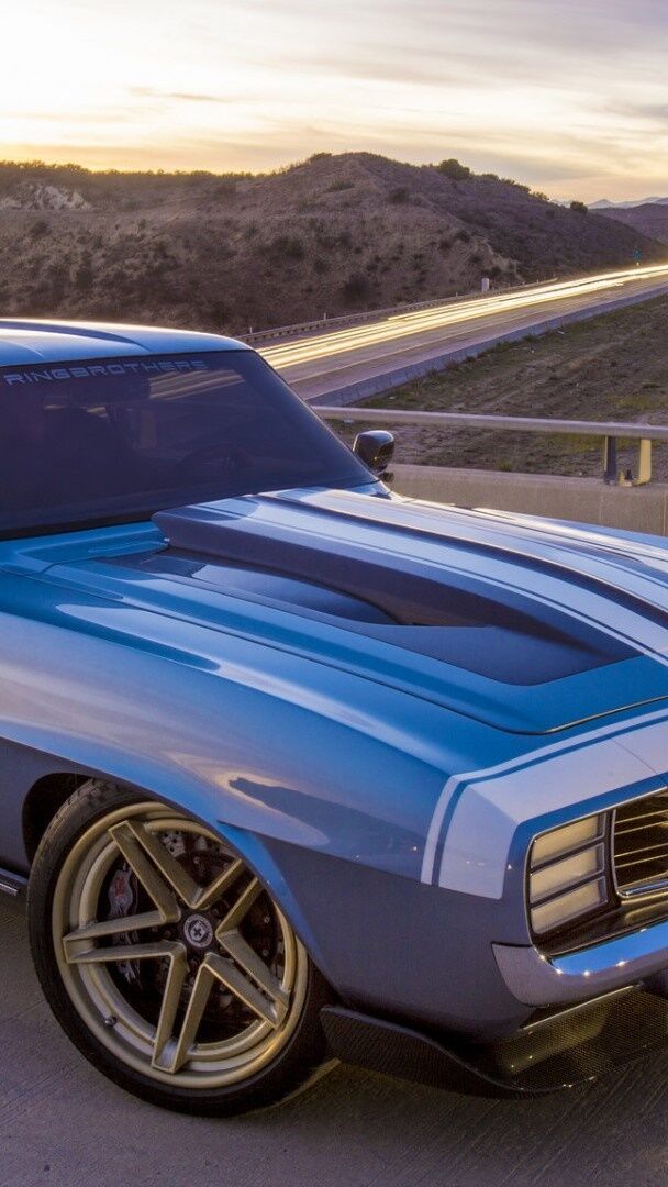 Blue 1969 Chevrolet Camaro Muscle Car at Sunset Highway Overlook - backiee