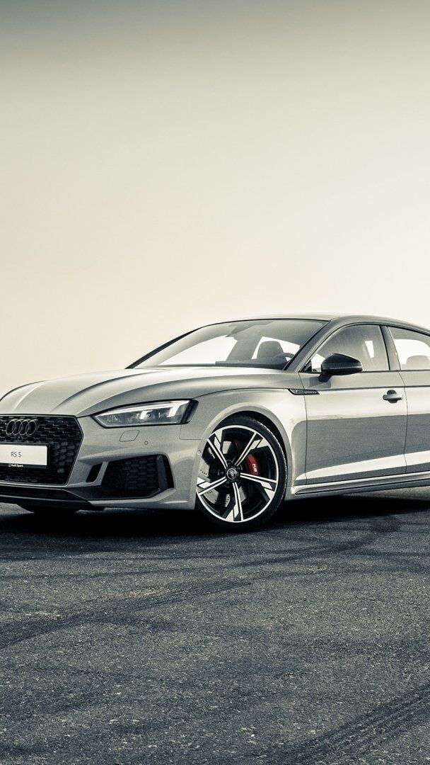 Silver Audi RS5 Coupe Poised on Open Desert Asphalt - backiee
