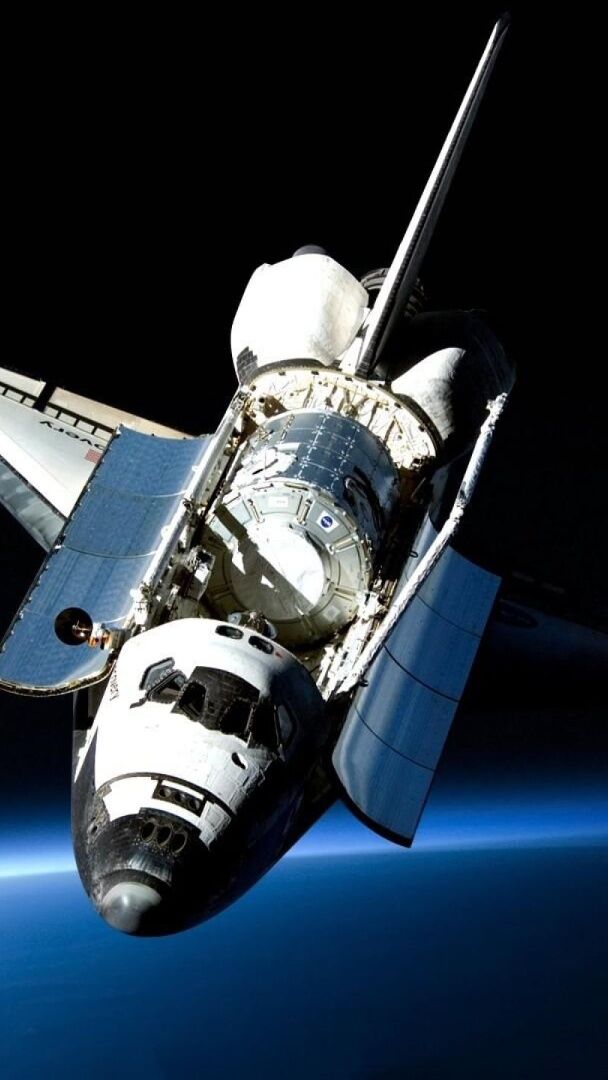 Space Shuttle Orbiter Gliding Above Earths Blue Horizon - backiee