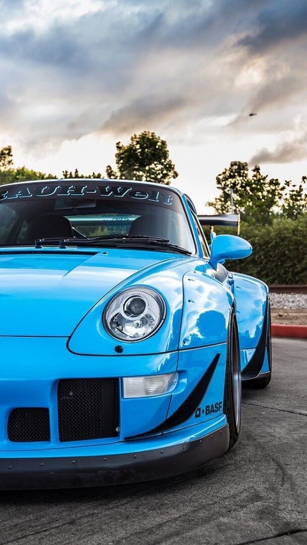 Electric Blue Porsche 911 Stance at Sunset Street Corner - backiee